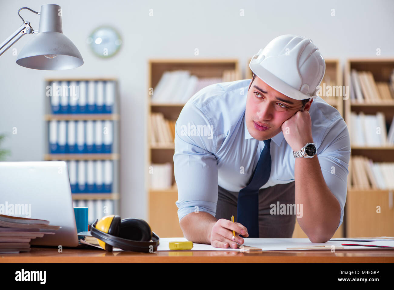 Engineer supervisor working on drawings in the office Stock Photo - Alamy