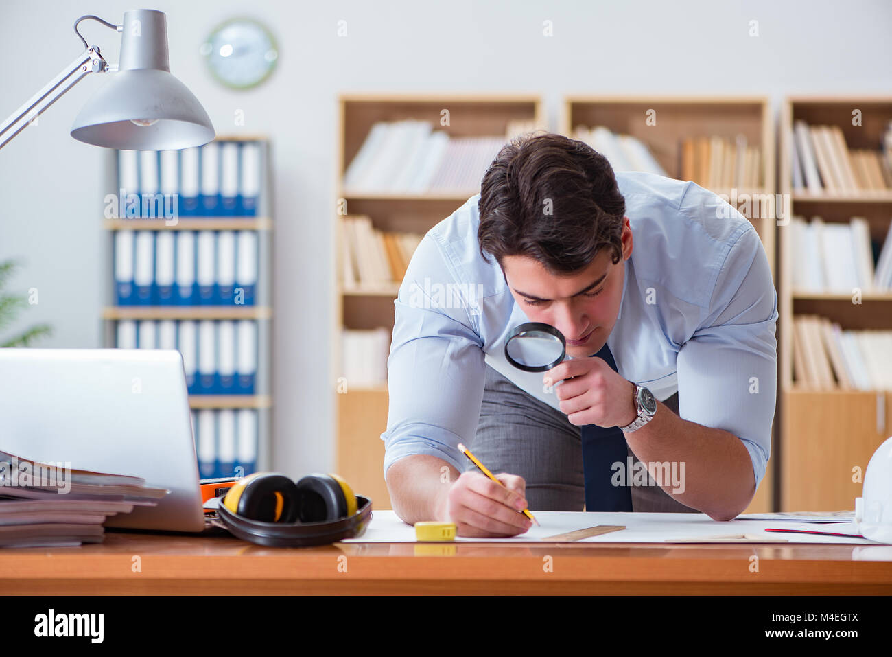 Engineer supervisor working on drawings in the office Stock Photo - Alamy