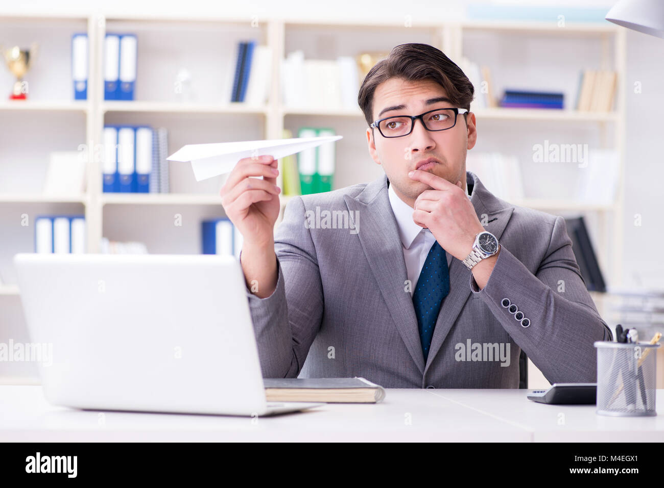Man folding paper airplane on hi-res stock photography and images - Alamy