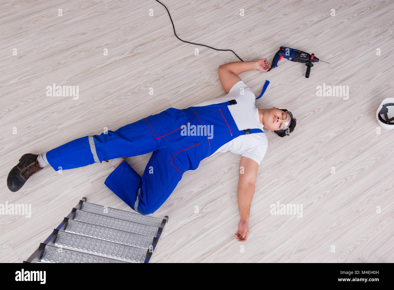 Worker after falling from height - unsafe behavior Stock Photo - Alamy