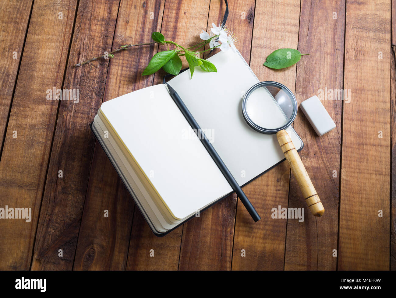 Blank notepad magnifier pencil hi-res stock photography and images - Alamy
