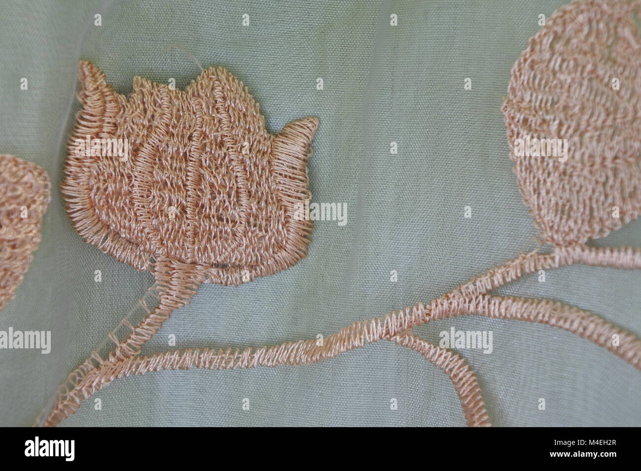 A meticulously crafted fabric flower, showcasing intricate artistry ...