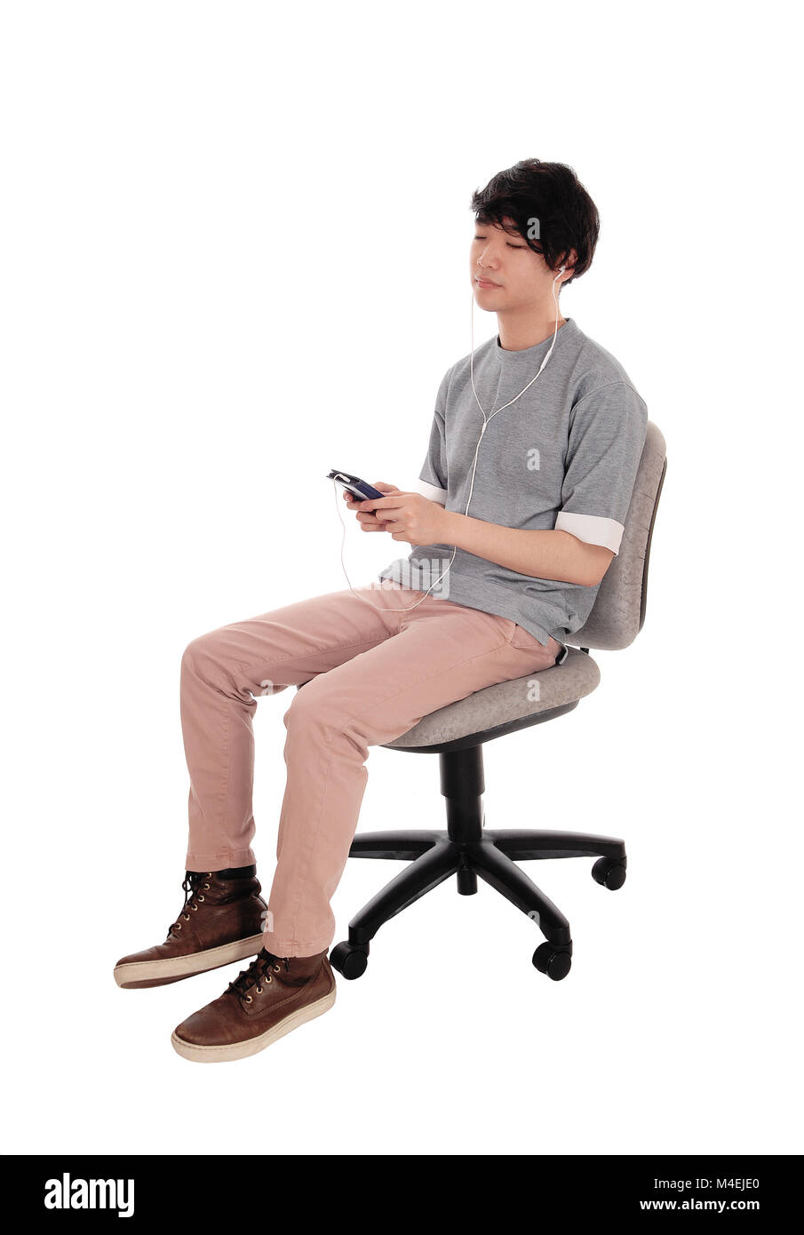 Man sitting looking cell Cut Out Stock Images & Pictures - Alamy