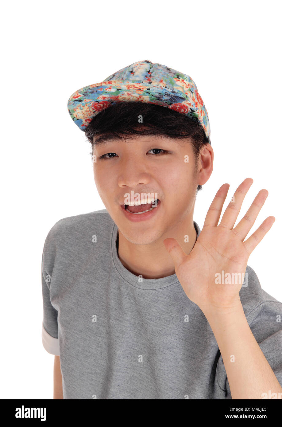 Happy Asian man with cap Stock Photo - Alamy