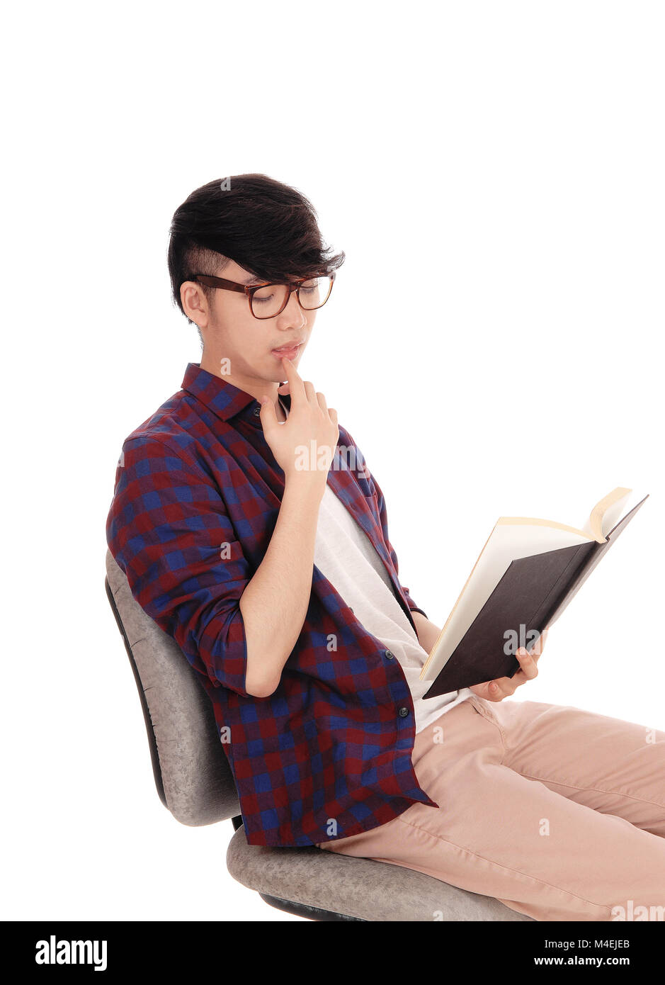 Closeup of Asian man reading a book Stock Photo - Alamy