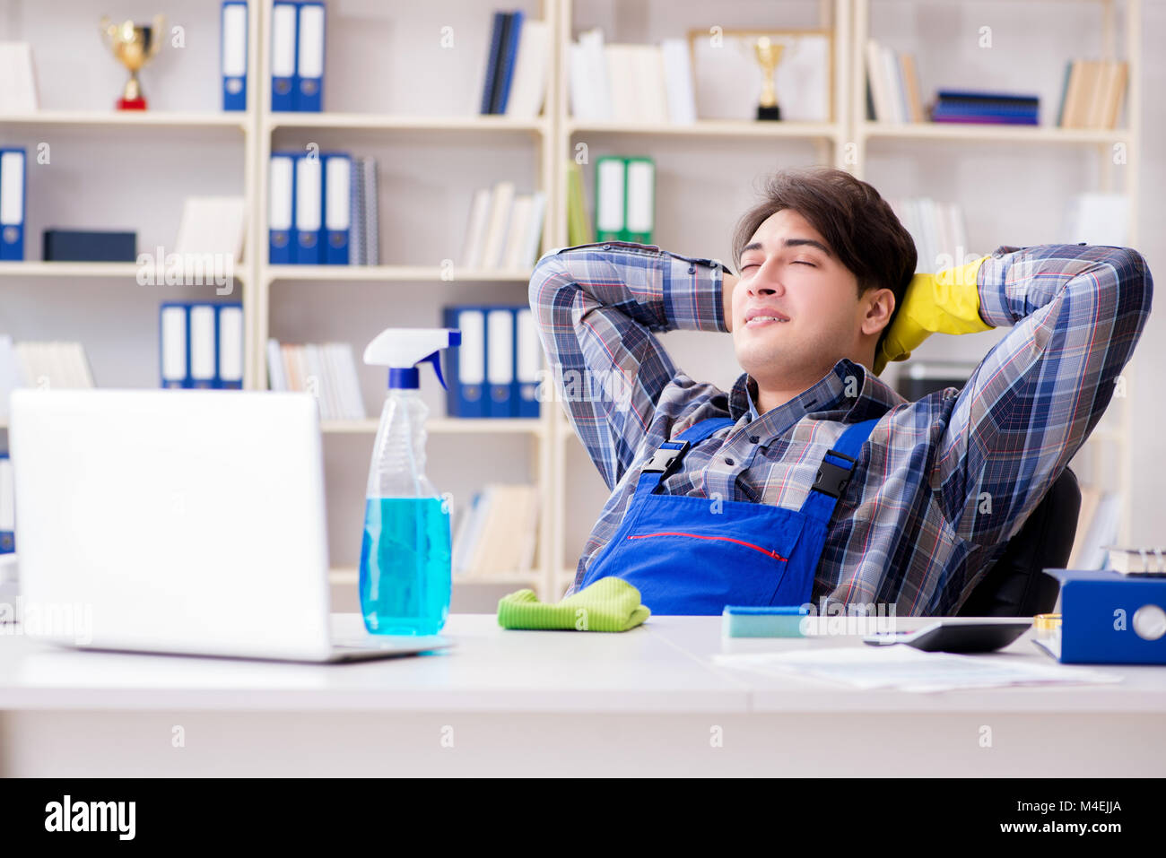 Male cleaner working in the office Stock Photo - Alamy