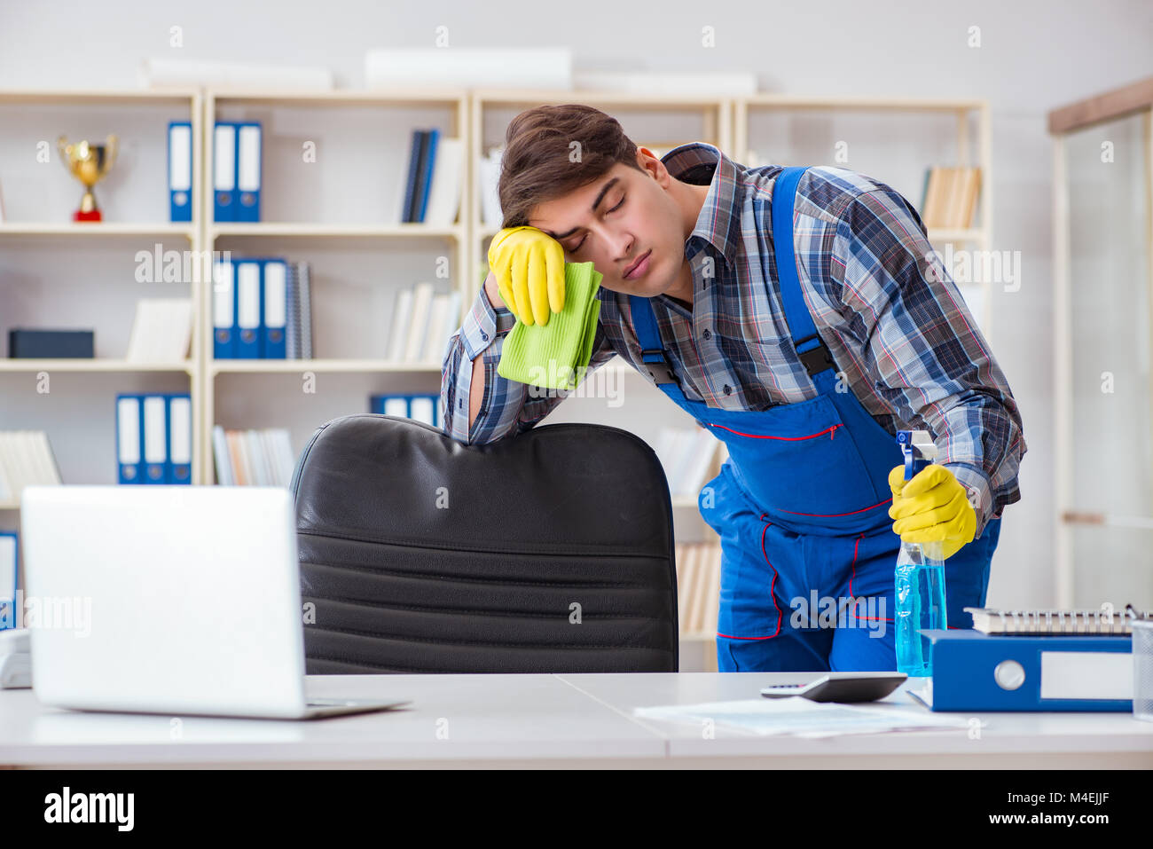 Male cleaner working in the office Stock Photo - Alamy