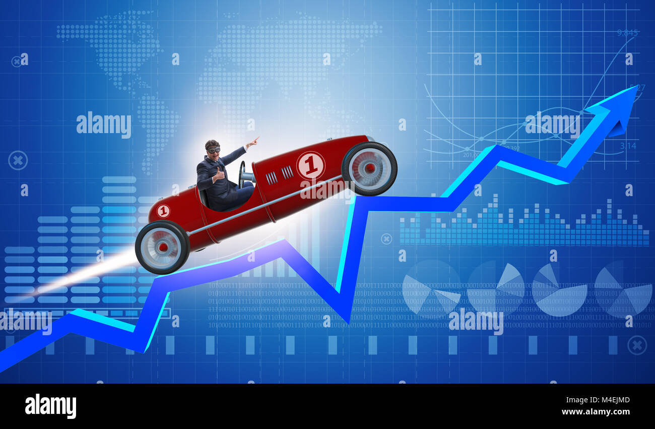 Businessman riding sports car against charts Stock Photo - Alamy