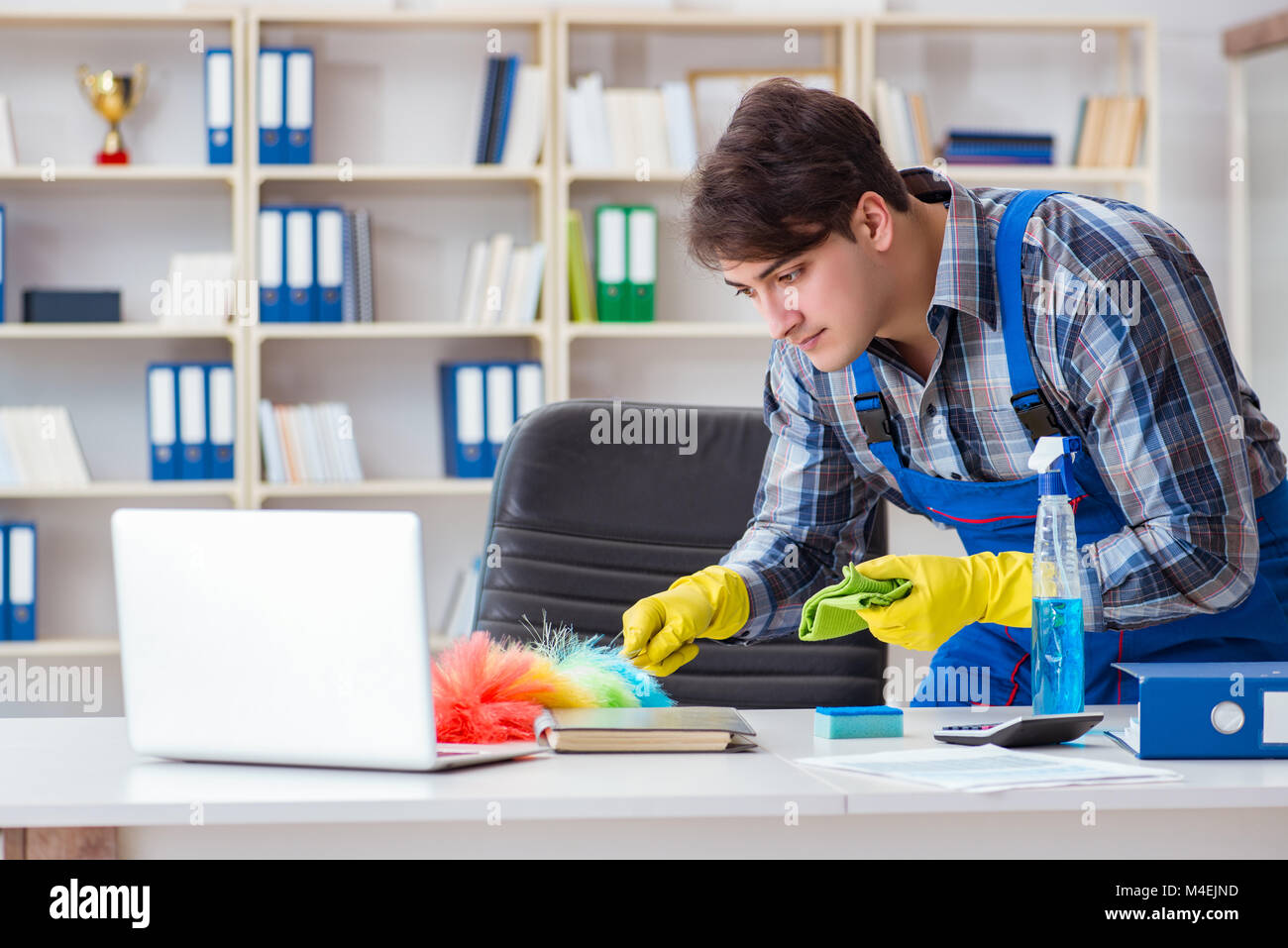 Male cleaner working in the office Stock Photo - Alamy