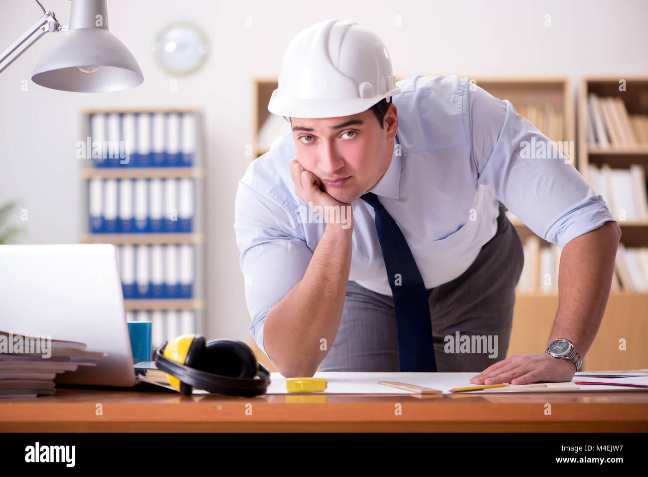 Engineer supervisor working on drawings in the office Stock Photo - Alamy