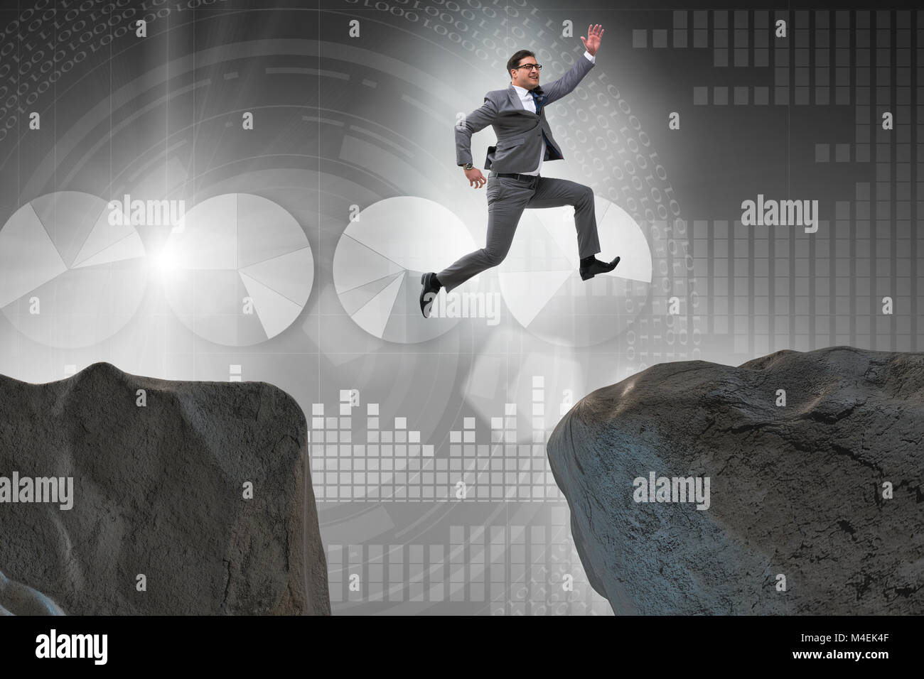 Ambitious businessman jumping over the cliff Stock Photo - Alamy