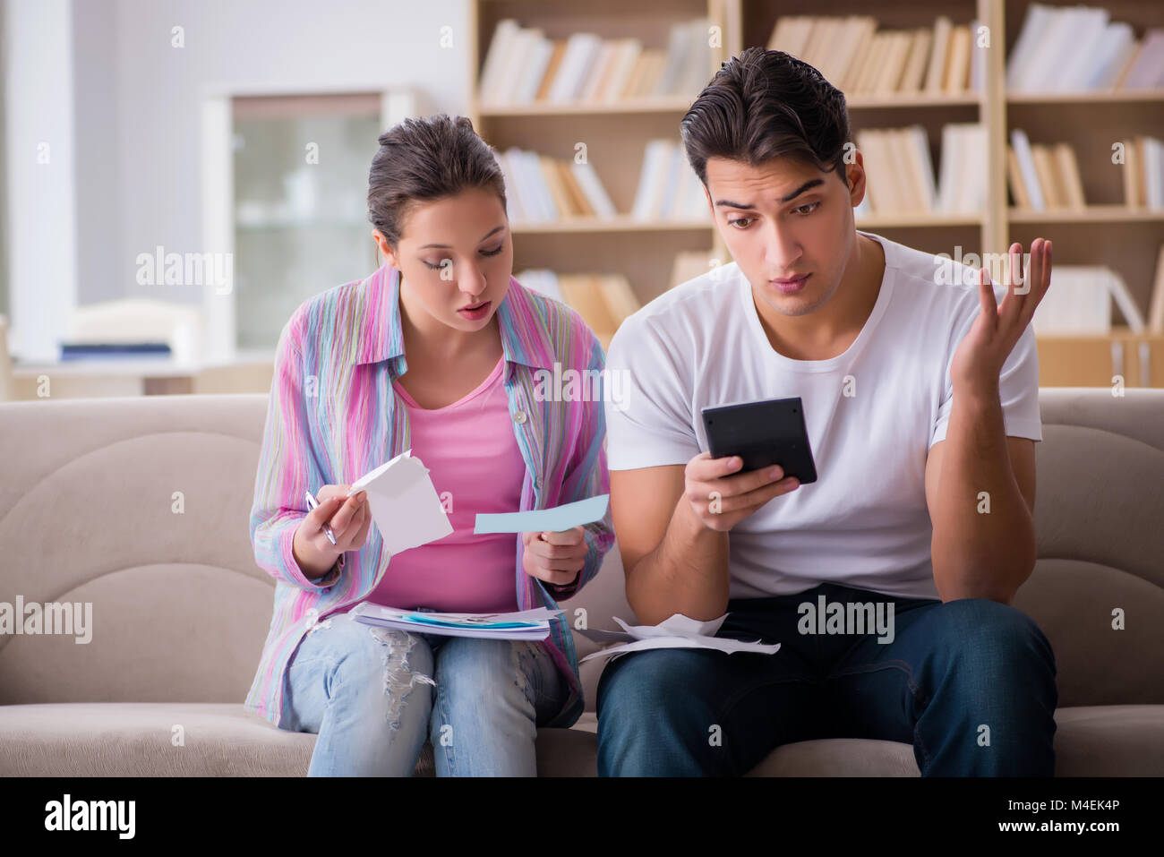 Young family discussing family finances Stock Photo - Alamy