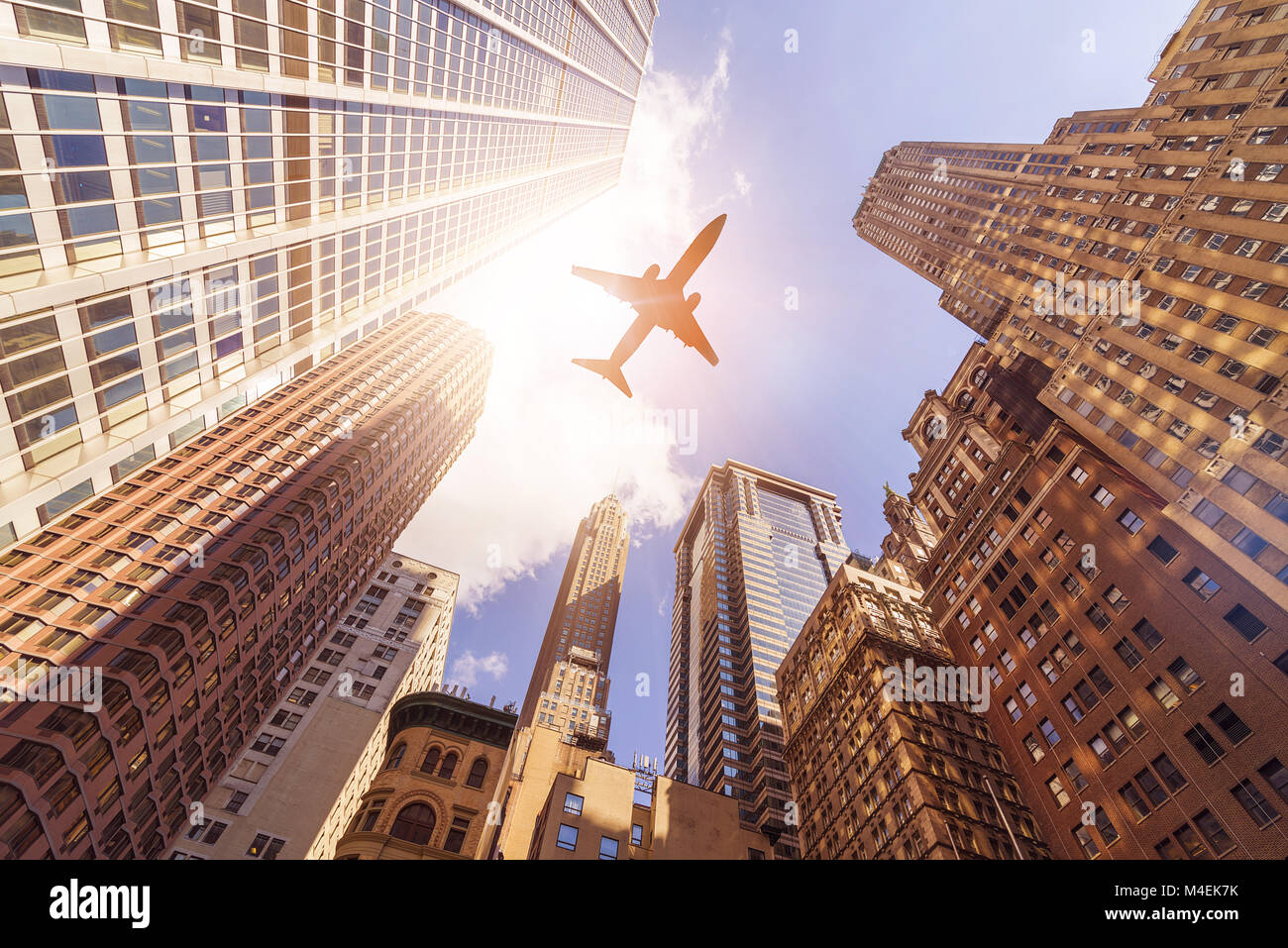 plane over highrise buildings Stock Photo - Alamy