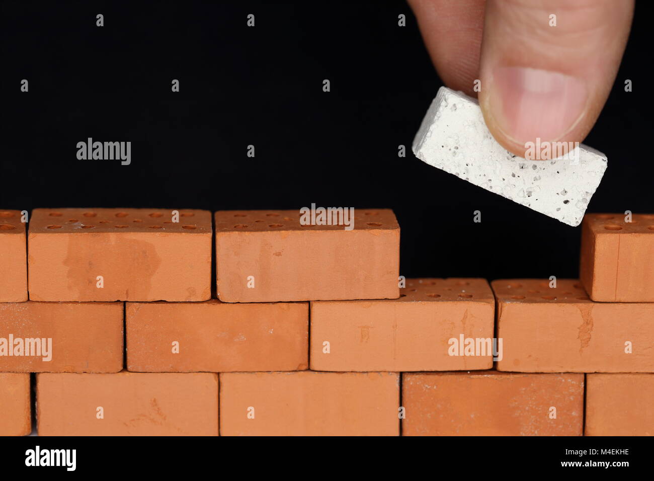 wall and one brick Stock Photo - Alamy