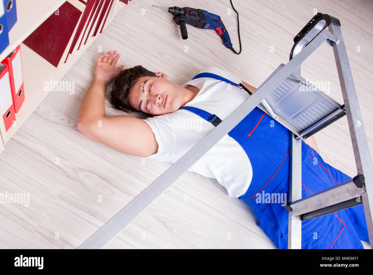 Unsafe behavior concept with falling worker Stock Photo - Alamy