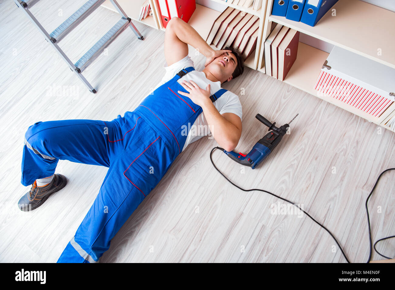 Unsafe behavior concept with falling worker Stock Photo - Alamy