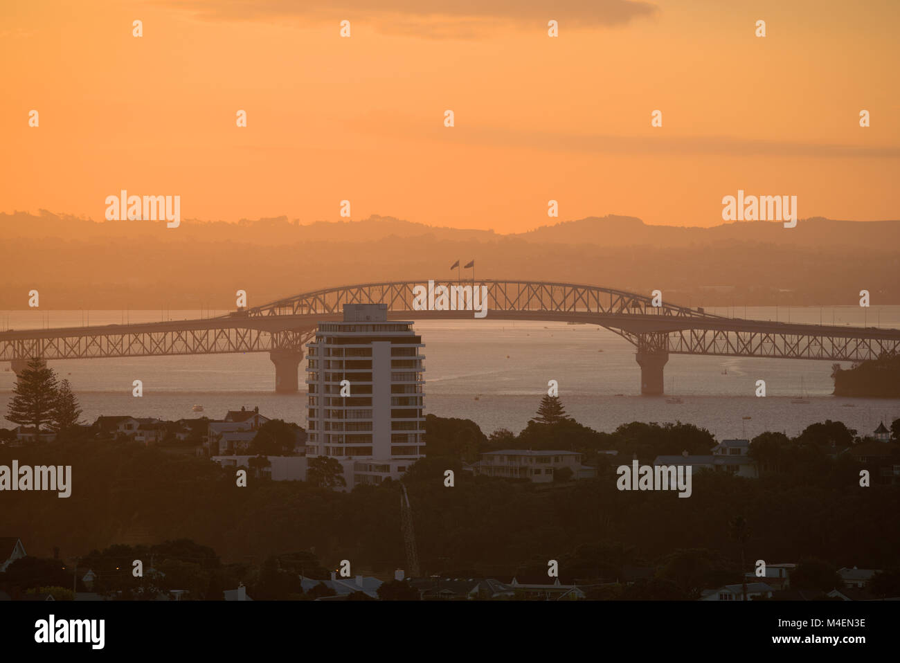 Auckland Harbor bridge at sunset Stock Photo - Alamy