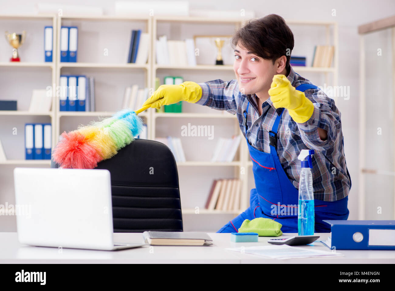 Male cleaner working in the office Stock Photo - Alamy