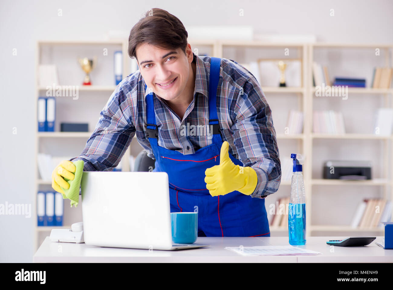 Male cleaner working in the office Stock Photo - Alamy