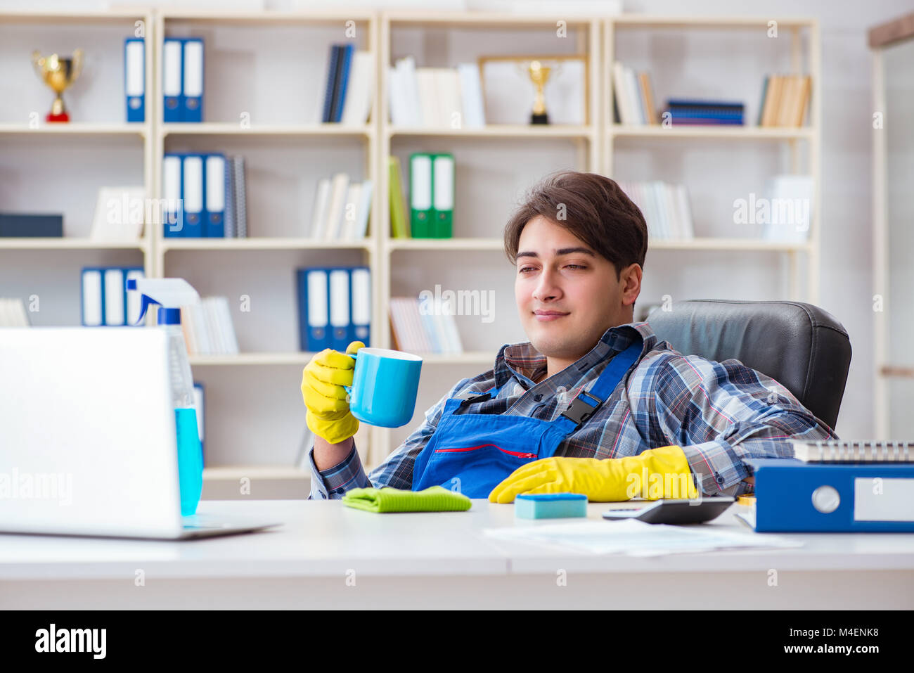 Male cleaner working in the office Stock Photo - Alamy