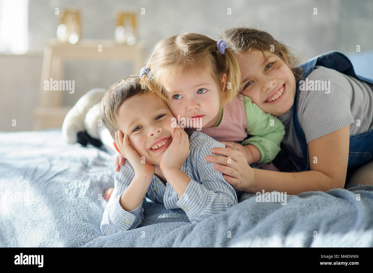 Two sisters and a brother. Three children from the same family are ...