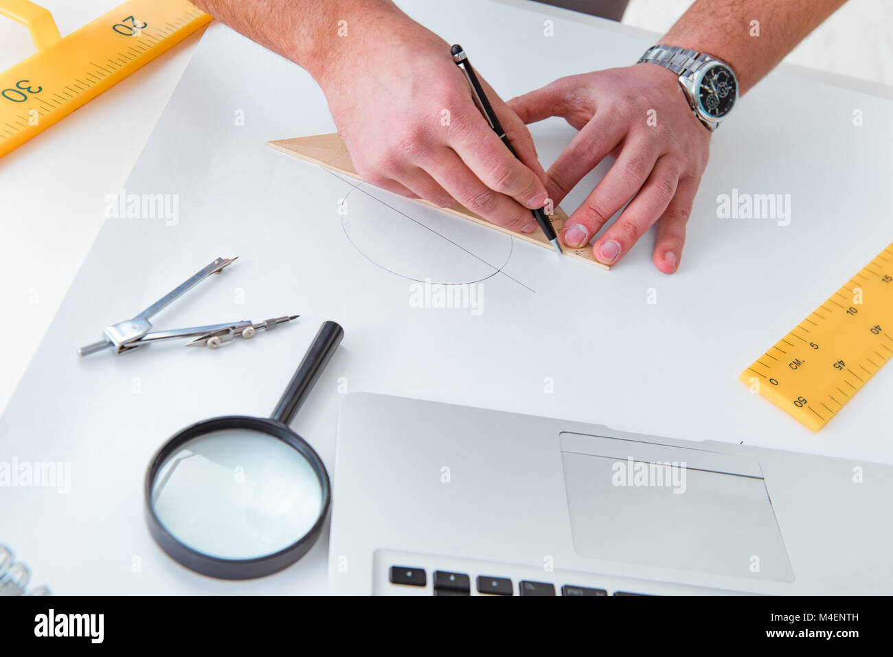 Male engineer working on drawings and blueprints Stock Photo - Alamy
