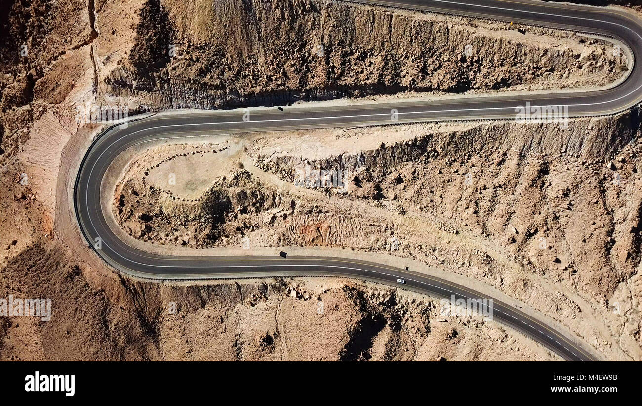 Desert road - Aerial image of traffic going up and down a serpentine ...