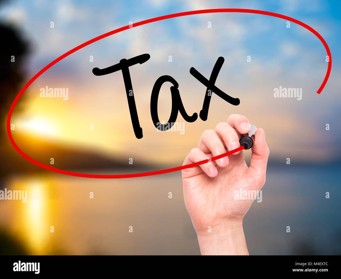 Man Hand writing Tax with black marker on visual screen Stock Photo - Alamy