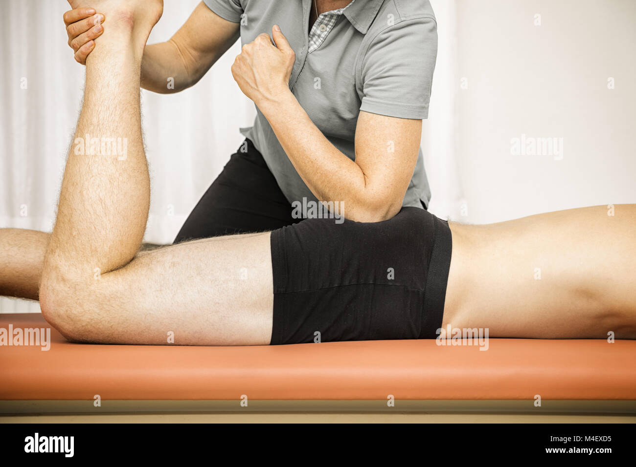 young man at the physio therapy Stock Photo - Alamy