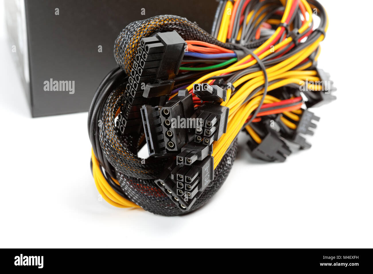 connecting wires to a computer on a white background Stock Photo - Alamy