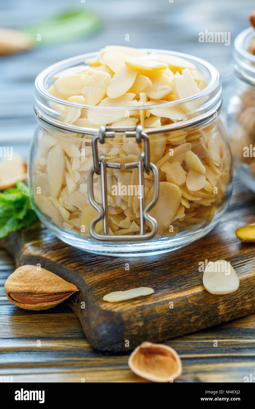 Almond flakes in a glass jar Stock Photo - Alamy