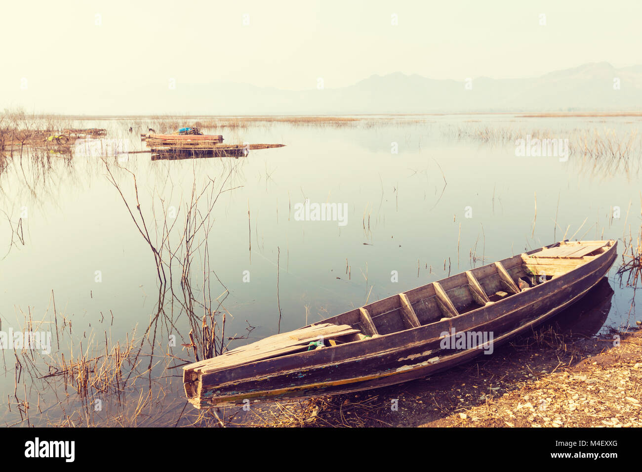 Boat on asian lake Stock Photo - Alamy