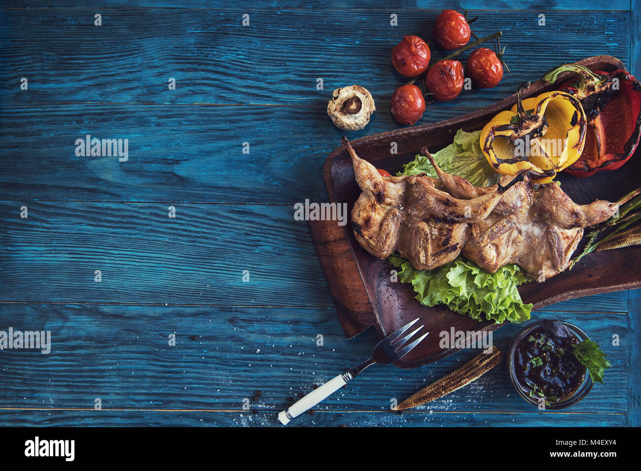 Grilled quail meat Stock Photo - Alamy