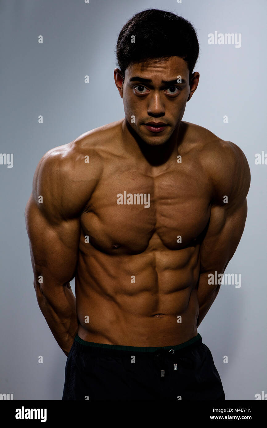 A fitness model torso with the chest muscles tightly flexed. Medium ...