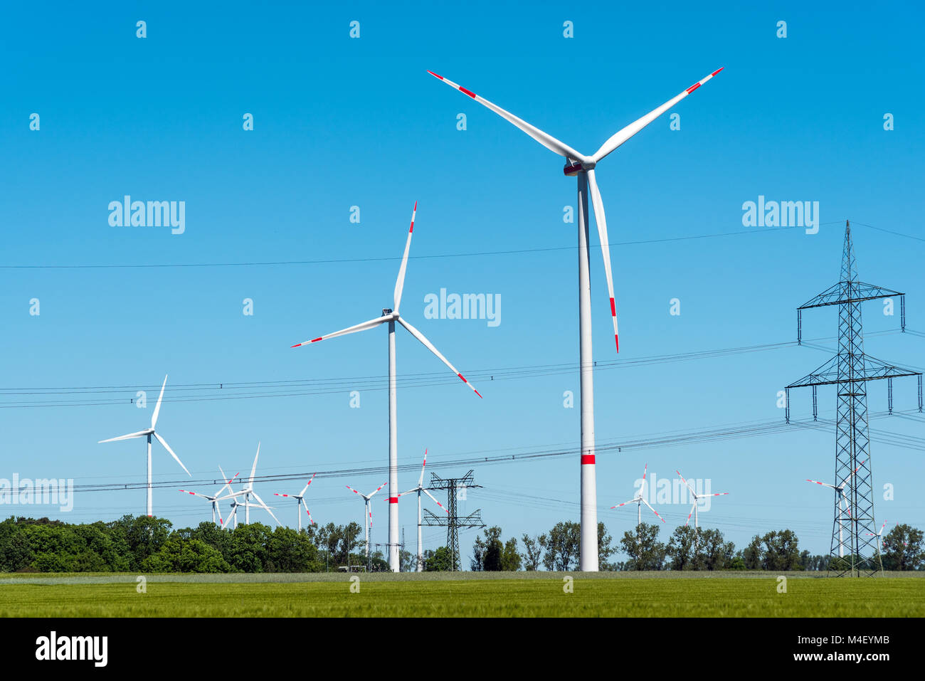 Power transmission lines and windwheels seen in rural Germany Stock ...