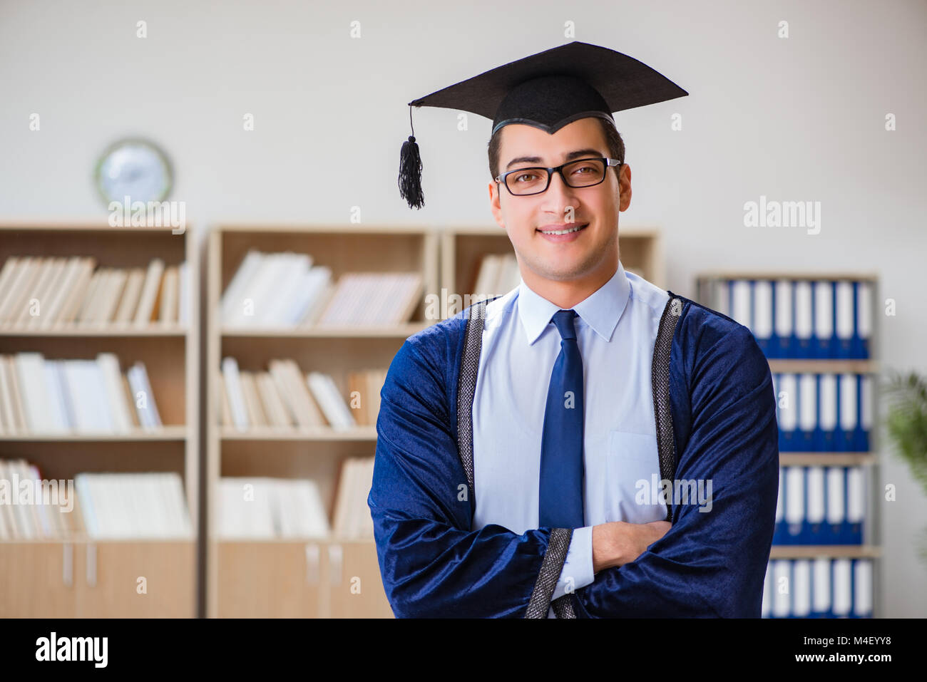 Young man graduating from university Stock Photo - Alamy