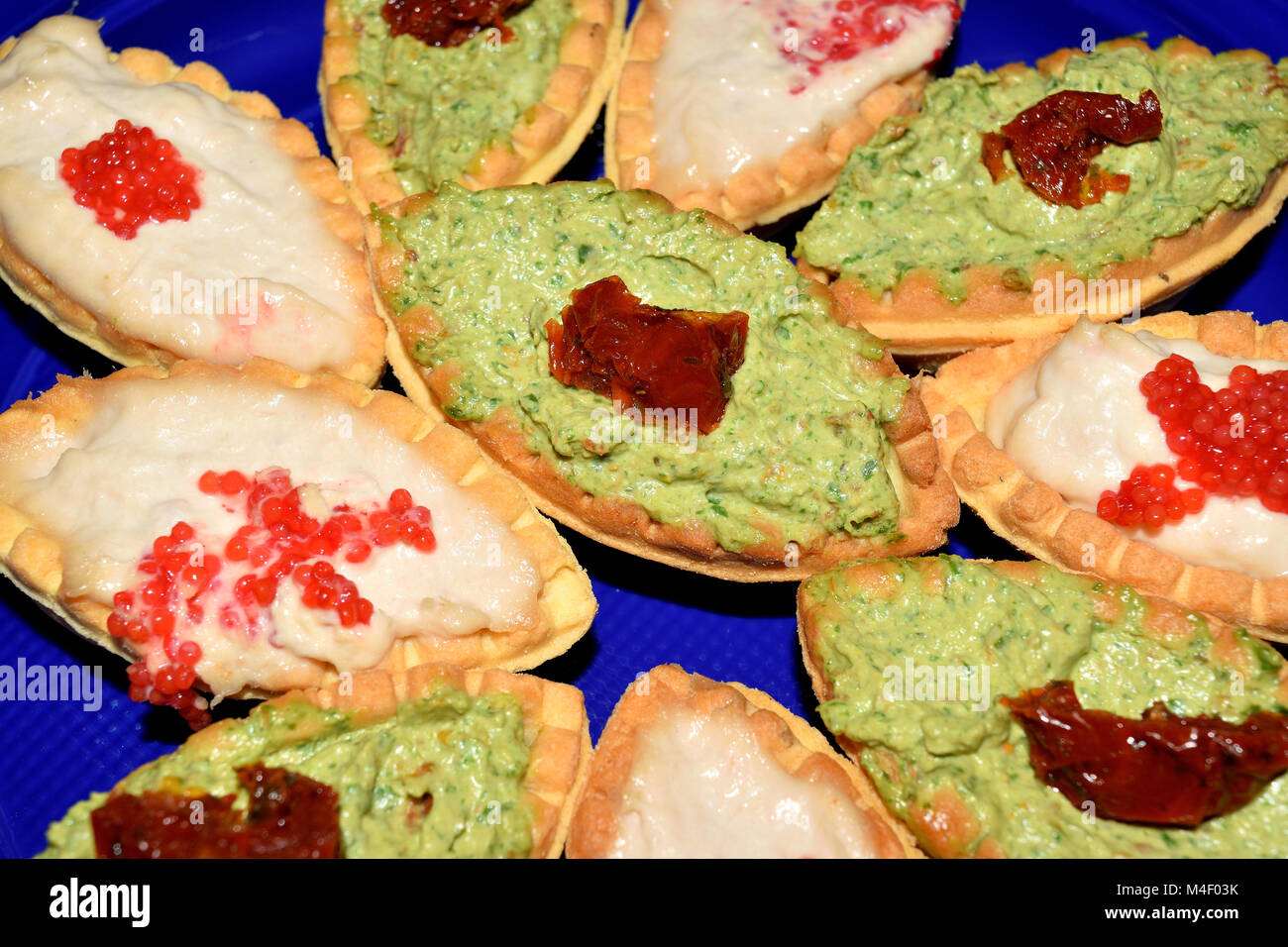 biscuits in the shape of boat stuffed with various creams Stock Photo ...