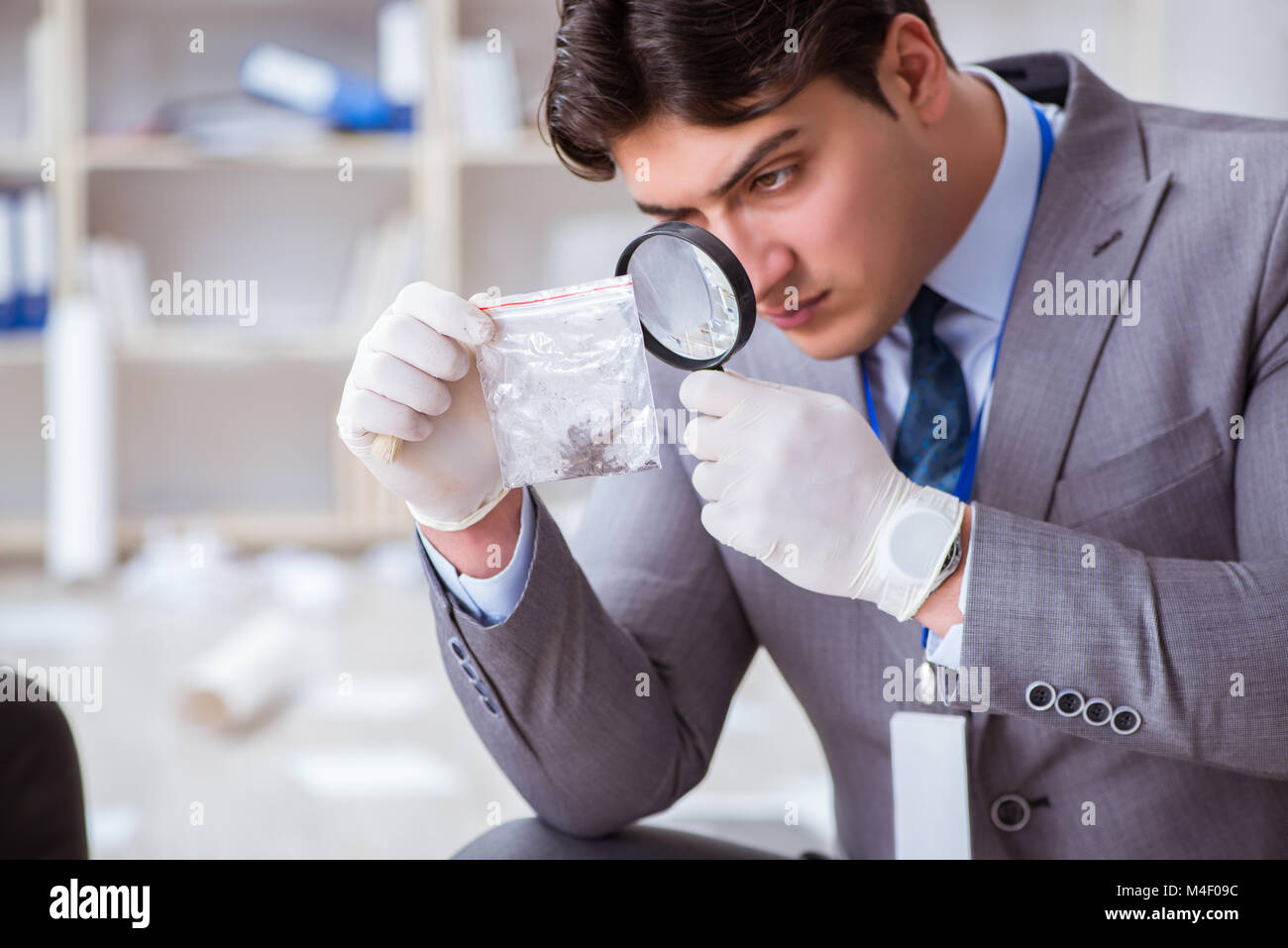 Young man during crime investigation in office Stock Photo - Alamy