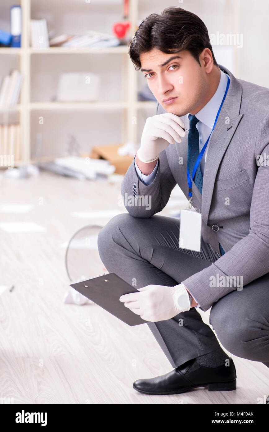 Young man during crime investigation in office Stock Photo - Alamy
