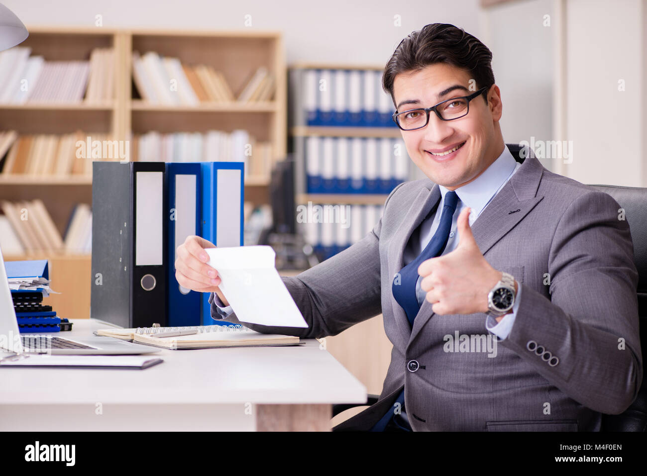 Businessman receiving letter in the office Stock Photo - Alamy