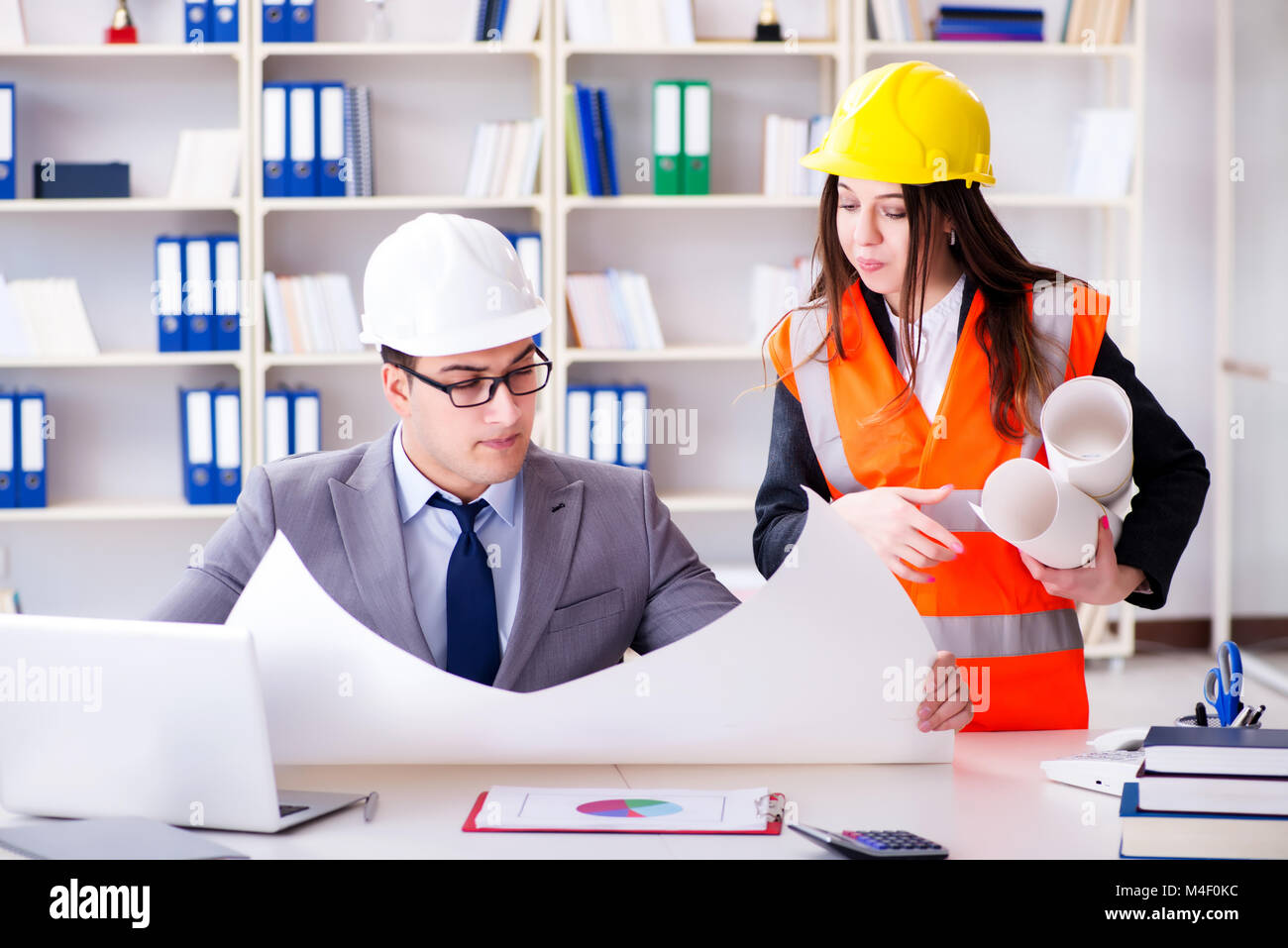 Reviewing architectural drawings hi-res stock photography and images ...