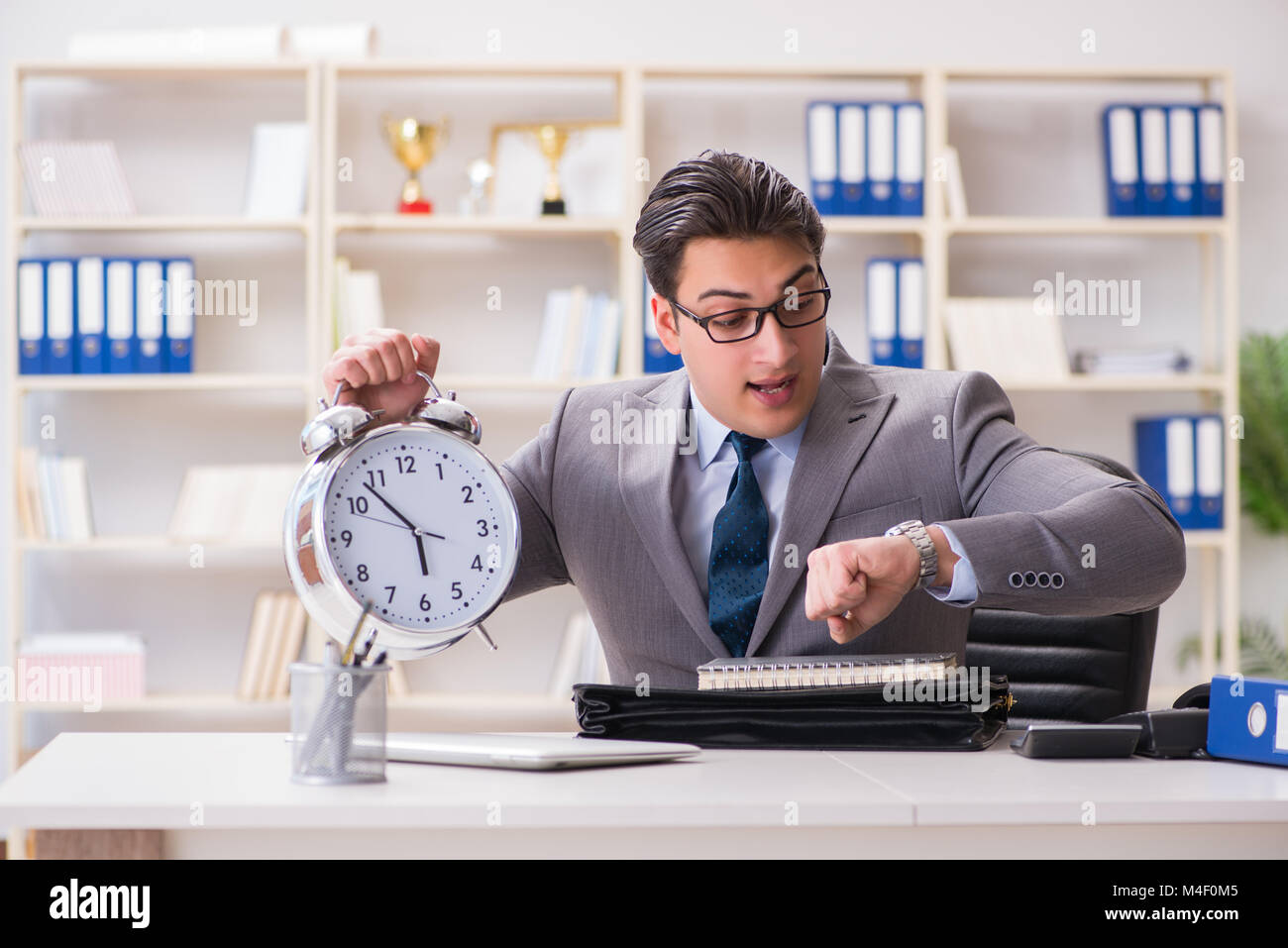 Businessman rushing in the office Stock Photo - Alamy
