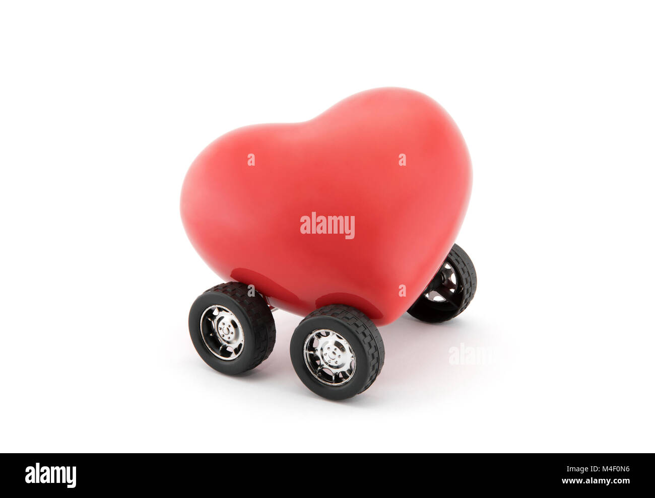 Heart on wheels isolated on white background with clipping path Stock ...