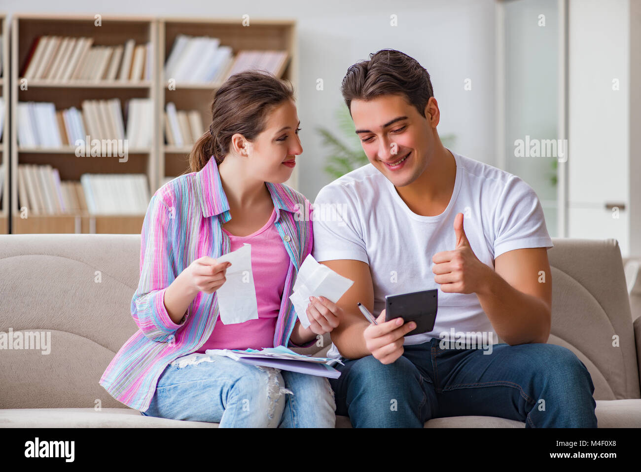 Couple finances happy receipt hi-res stock photography and images - Alamy