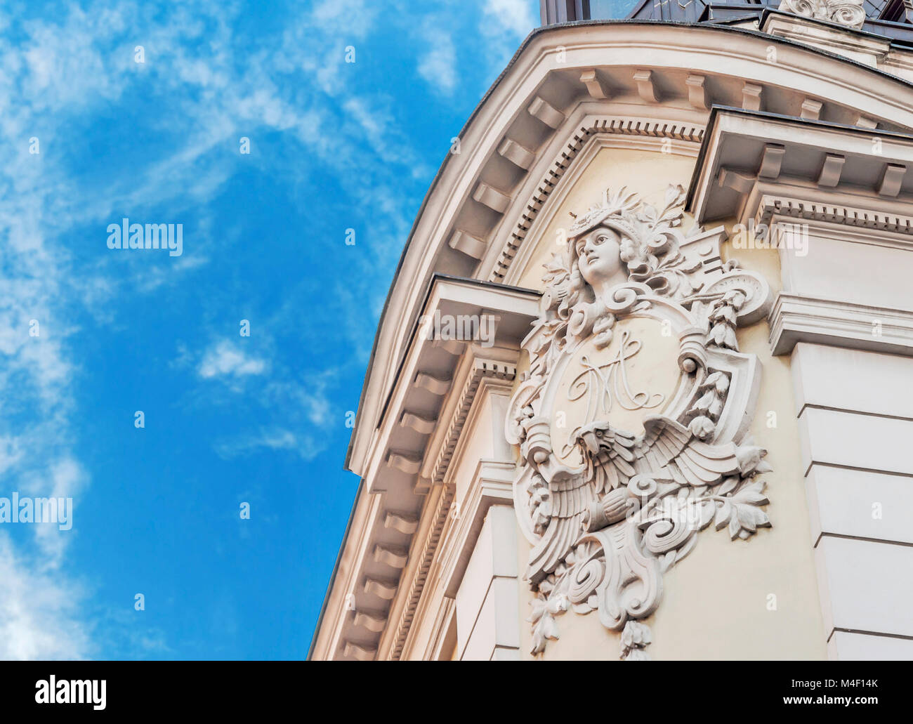 Historic building detail with blue cloudy sky Stock Photo - Alamy