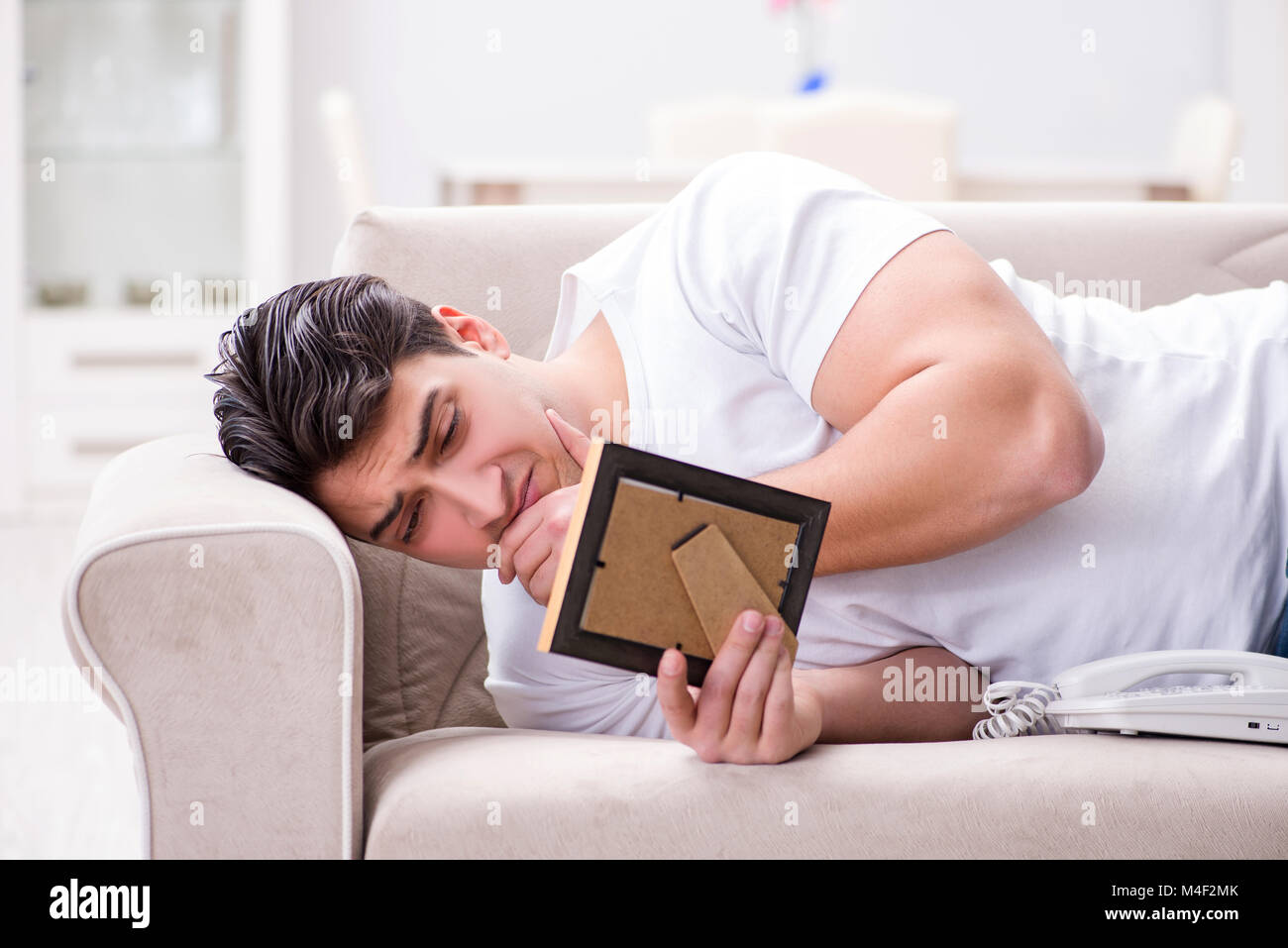 Young man in sad saint valentine concept Stock Photo - Alamy