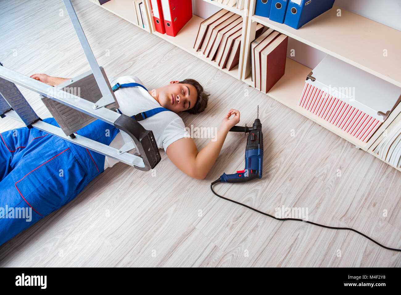 Unsafe behavior concept with falling worker Stock Photo - Alamy