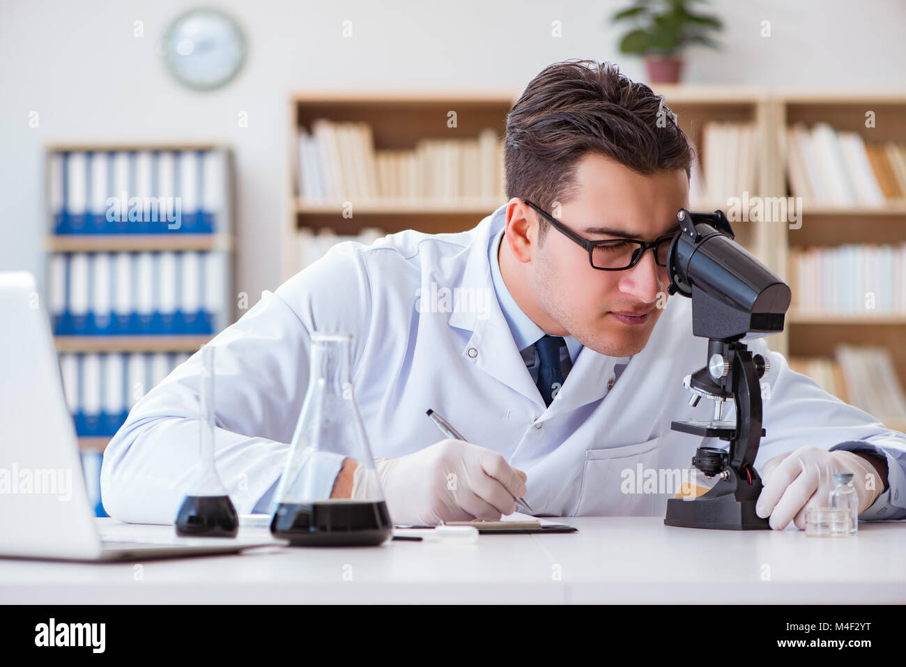 Chemical engineer working on oil samples in lab Stock Photo - Alamy