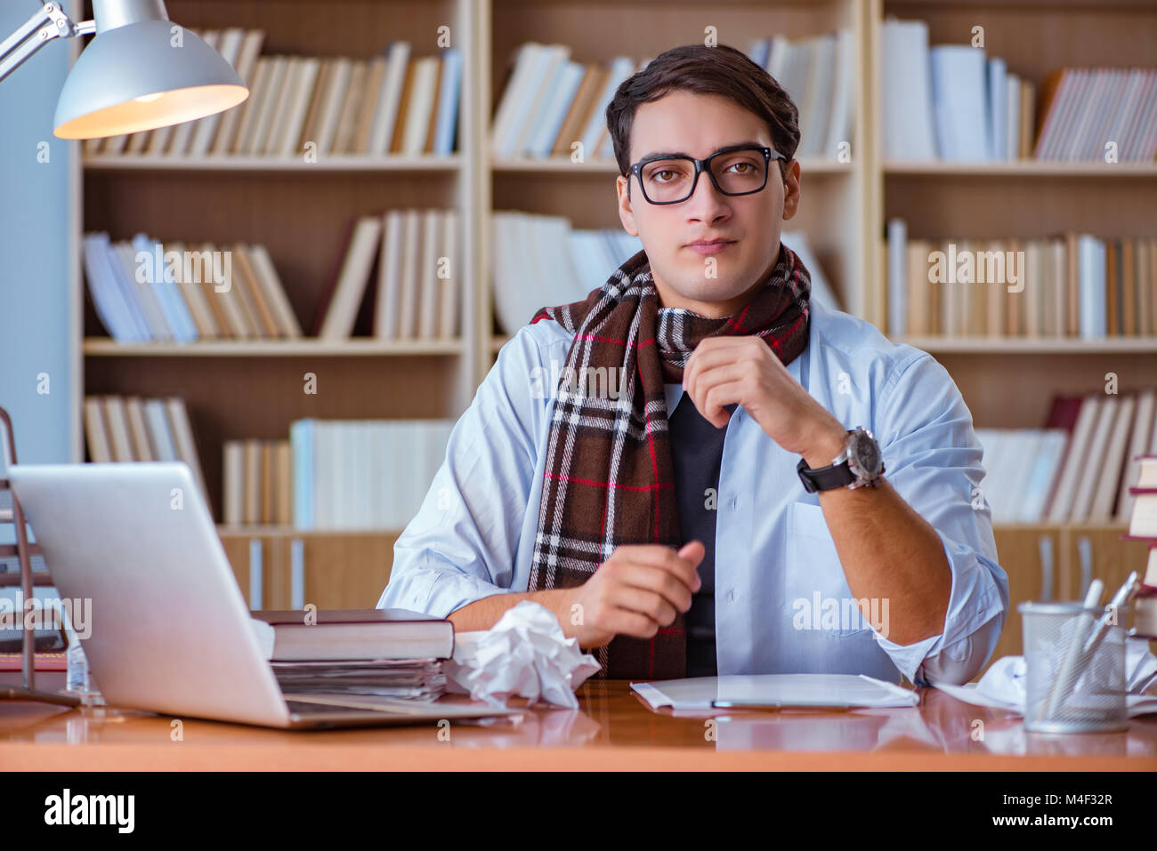 Young book writer writing in library Stock Photo - Alamy