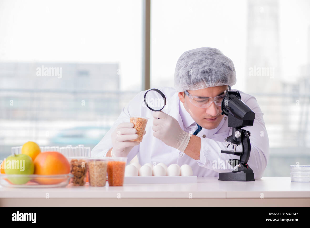 Scientist studying various food products Stock Photo - Alamy